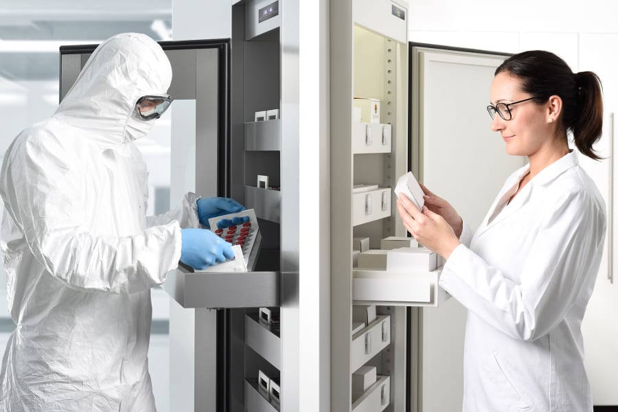 Laboratory staff take samples from a refrigerator
